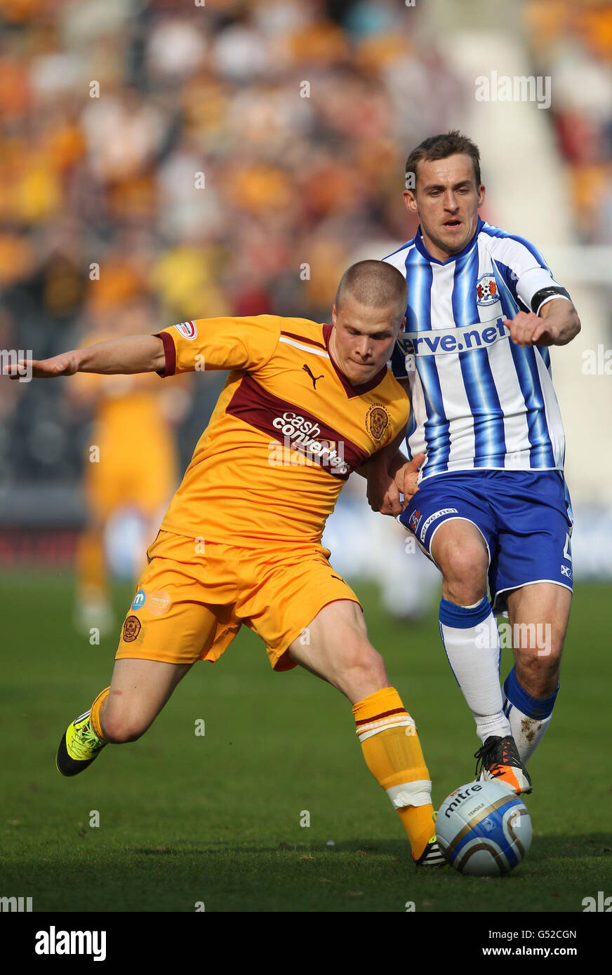 Motherwell's Henrick Ojamaa and Kilmarnock's James Fowler in action ...