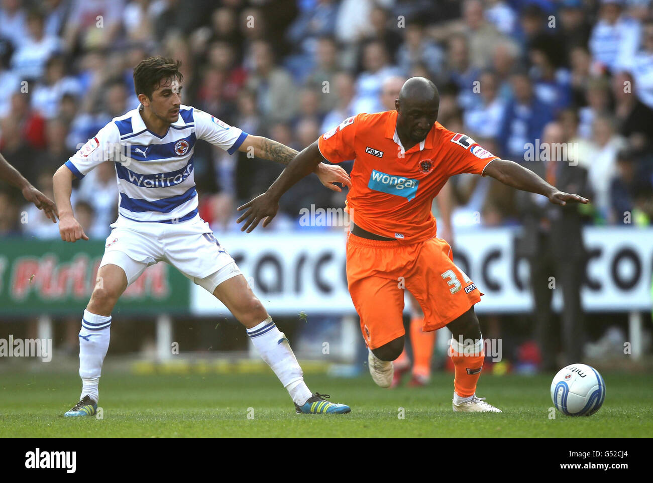 Blackpool's Lomana Tresor Lua Lua gets away from Reading's Jem Karacan ...