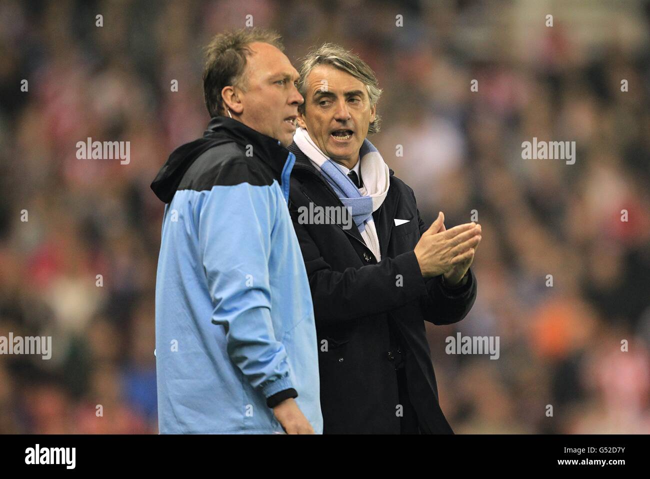 Manchester City manager Roberto Mancini with first team coach David ...