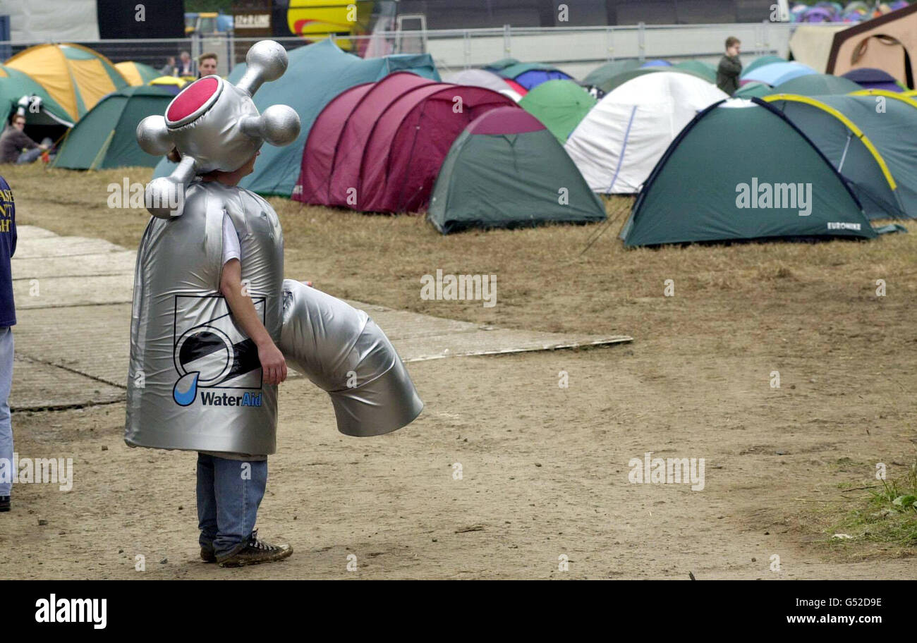 A festival goer has his own water supply at the usually water logged ...