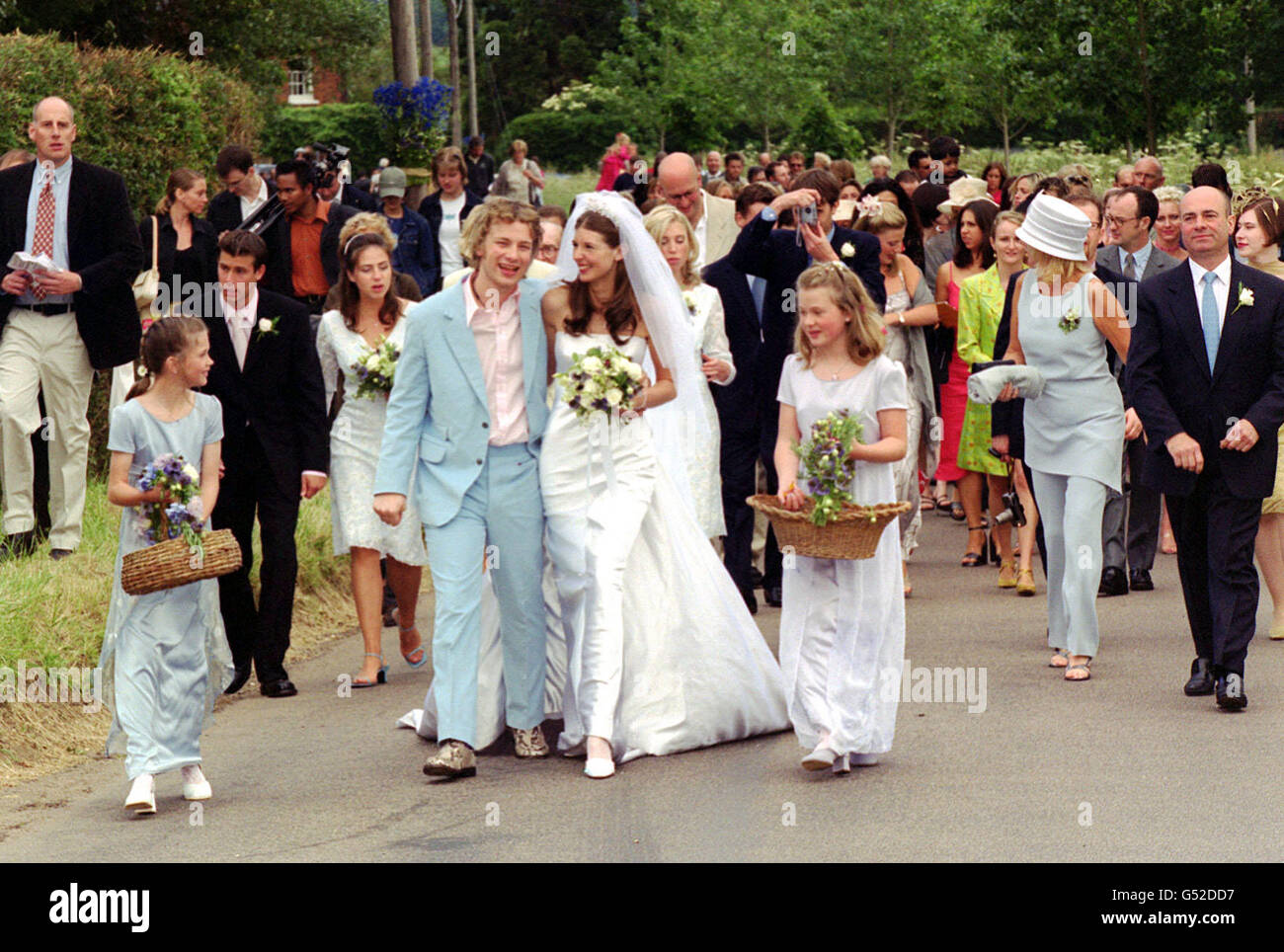 Celebrity television chef Jamie Oliver (centre, wearing a blue Paul ...