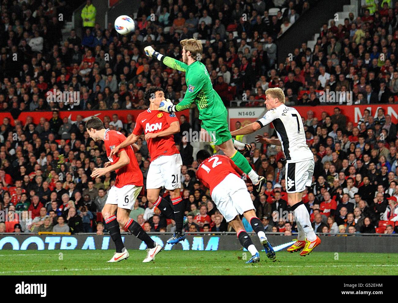 Manchester United goalkeeper David De Gea punches the ball clear from ...