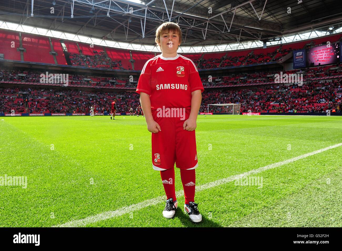 The Swindon Town matchday mascot poses for a photograph before kick off ...