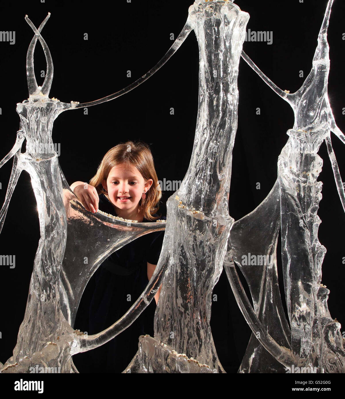 Elise Rance, 7, from London, looks at Palaces, a sculpture made ...