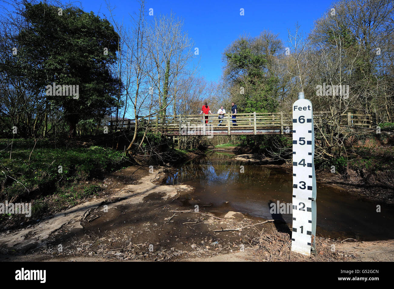 People enjoy the warm weather on the bank of Hodge Beck river near ...