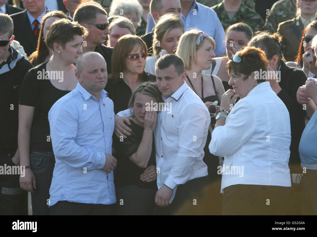Mourners pay their respect as the bodies of Sergeant Luke Taylor, 33 ...