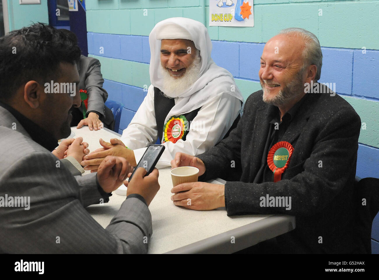 George Galloway of the Respect Party sits with his supporters as he ...
