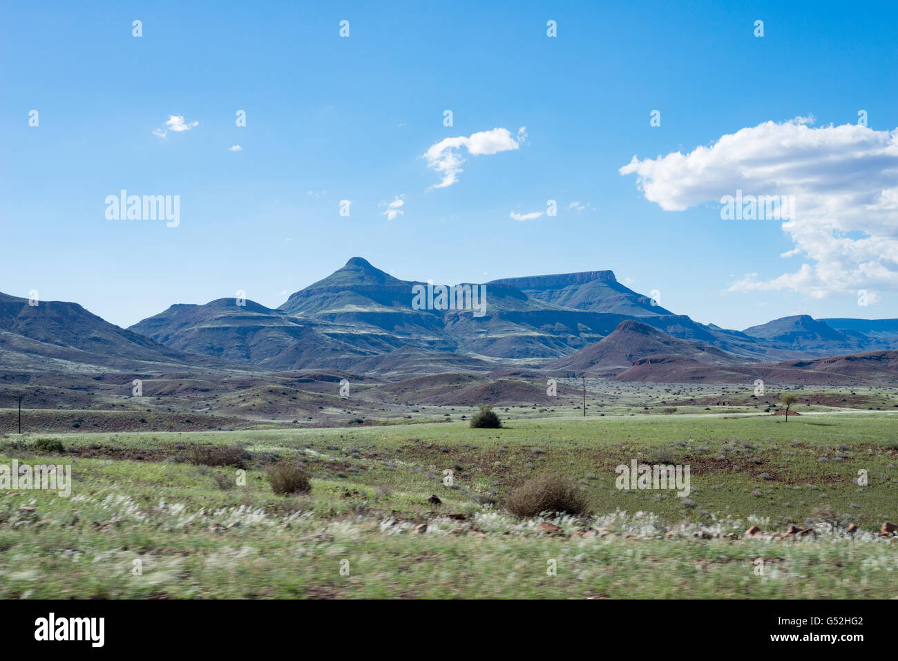 Namibia, Kunene, mountains under a blue cloudy sky, on the journey from ...