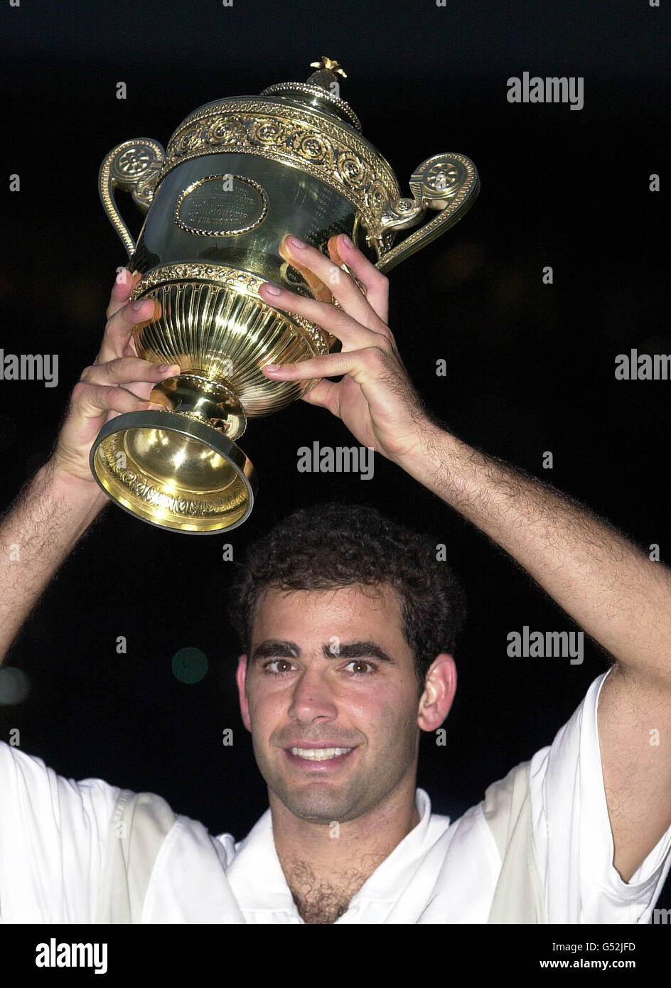 NO COMMERCIAL USE: America's Pete Sampras lifts the trophy as he ...