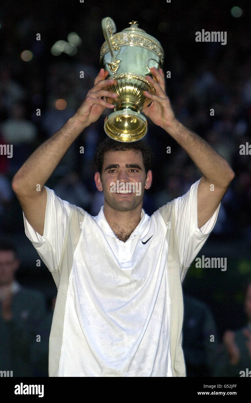 NO COMMERCIAL USE: America's Pete Sampras lifts the trophy as he ...