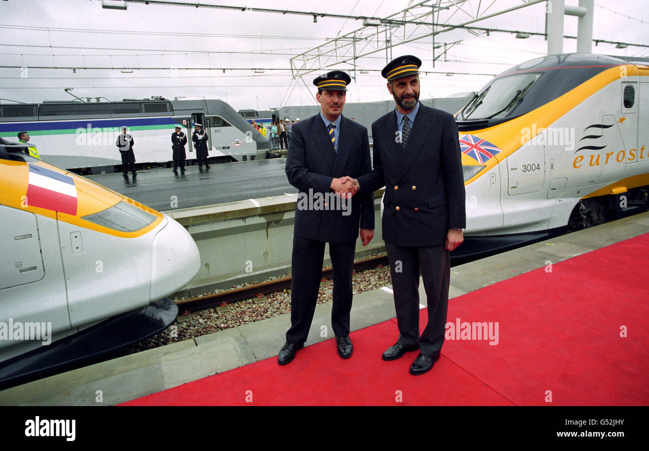 Eurostar drivers, Nigel Brown, left, and Francis Guilland, shake hands ...