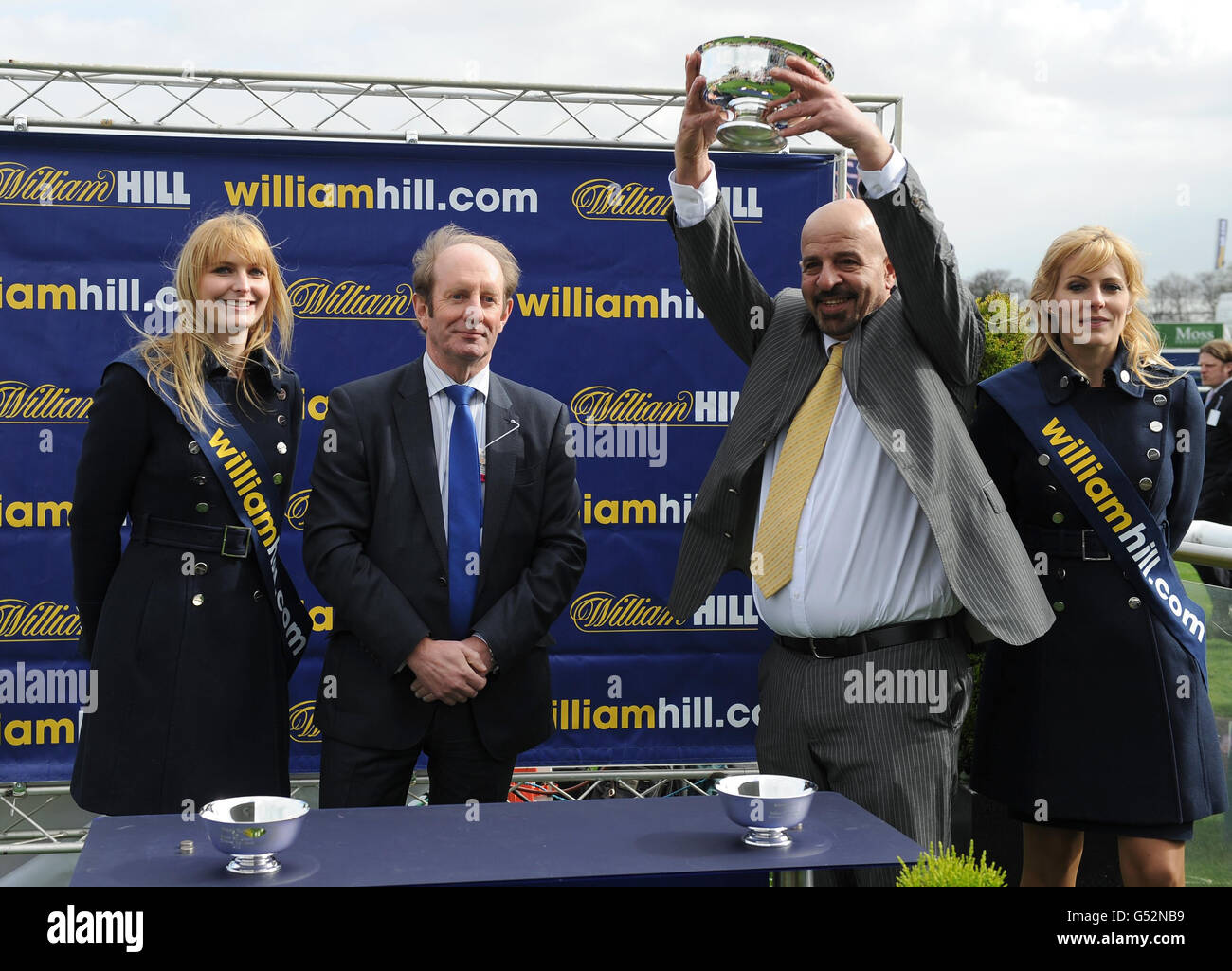 Owner Dr Marwan Koukash lifts the trophy after his horse, Brae Hill and ...