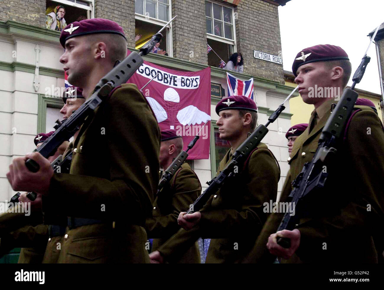 Military paras army marching leaving holding guns rifles red uniform hi ...