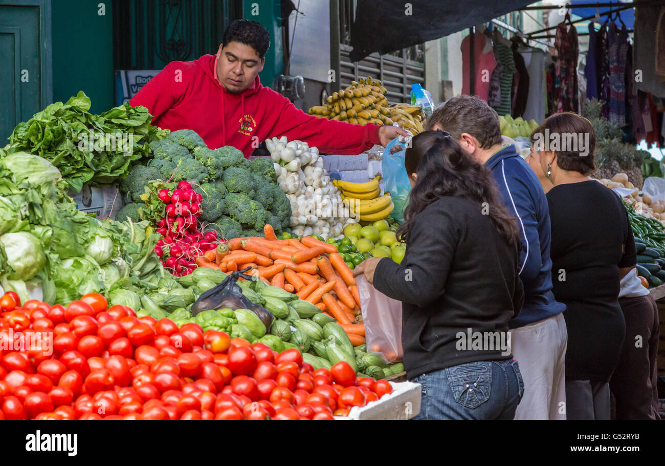 Mexican man selling fruits and vegetables at a mercado or market in the ...