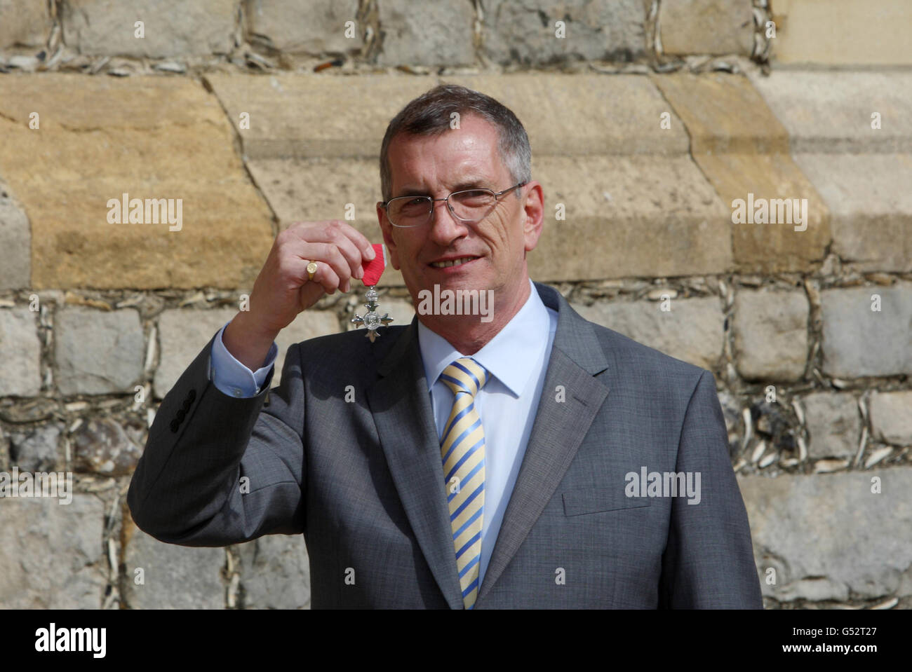 Nick Hillsdon after he was awarded an MBE by Queen Elizabeth II during ...