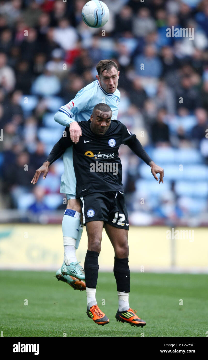 Coventry City's Richard Keogh and Peteborough United's Emile Sinclair ...