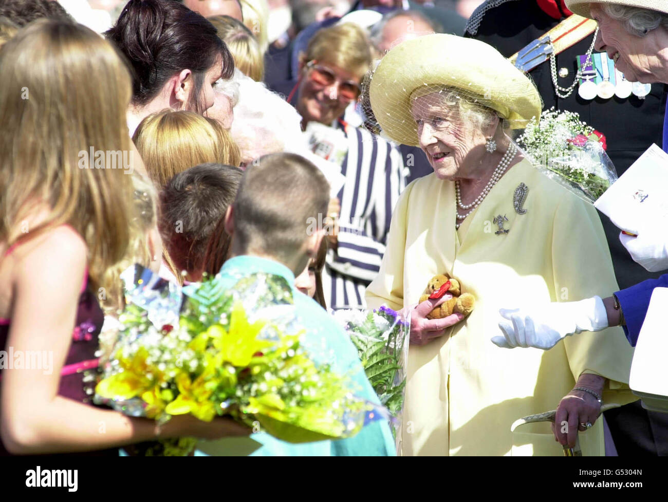 The Queen Mother receives a teddy bear from 4 year old Dean Parrot ...