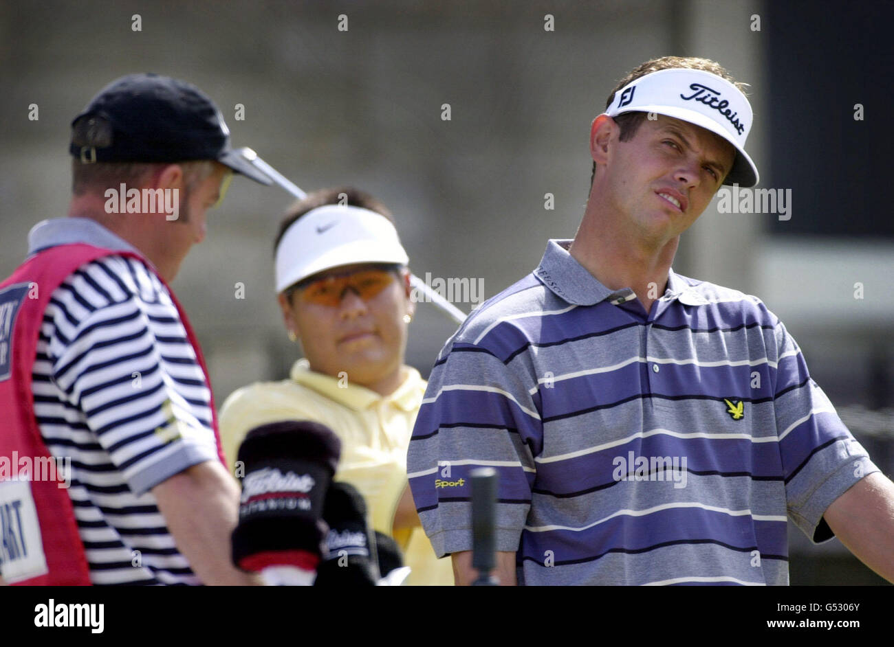Scotland's Andrew Coltart (r) stretches as he and the USA's Notah Begay ...