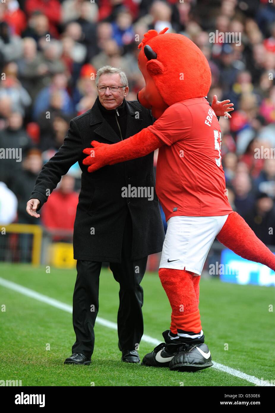 Manchester United manager Sir Alex Ferguson with club mascot Fred the ...