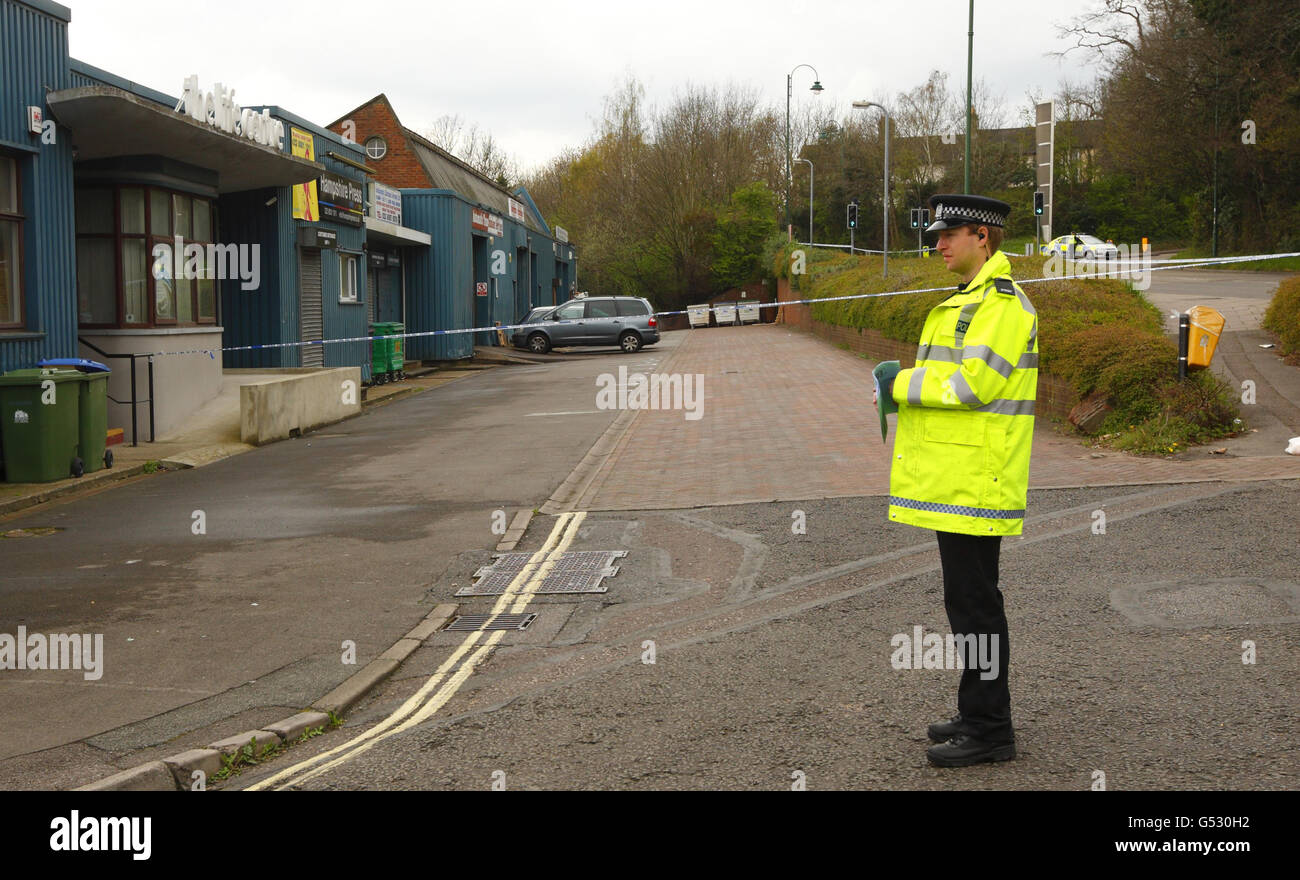 A Hampshire Police officer stands guard at the scene in Southampton ...