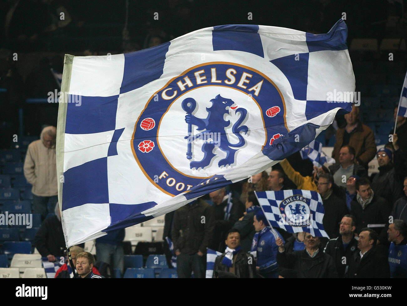 Stamford bridge chelsea fans wave flags in the stands hi-res stock ...