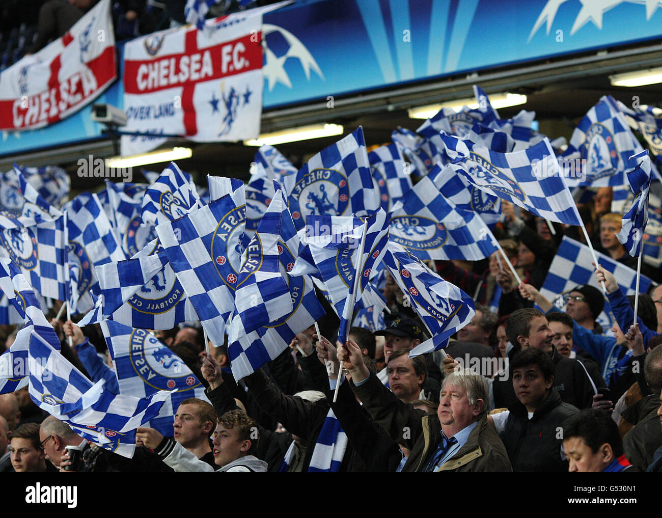 Stamford bridge chelsea fans wave flags in the stands hi-res stock ...