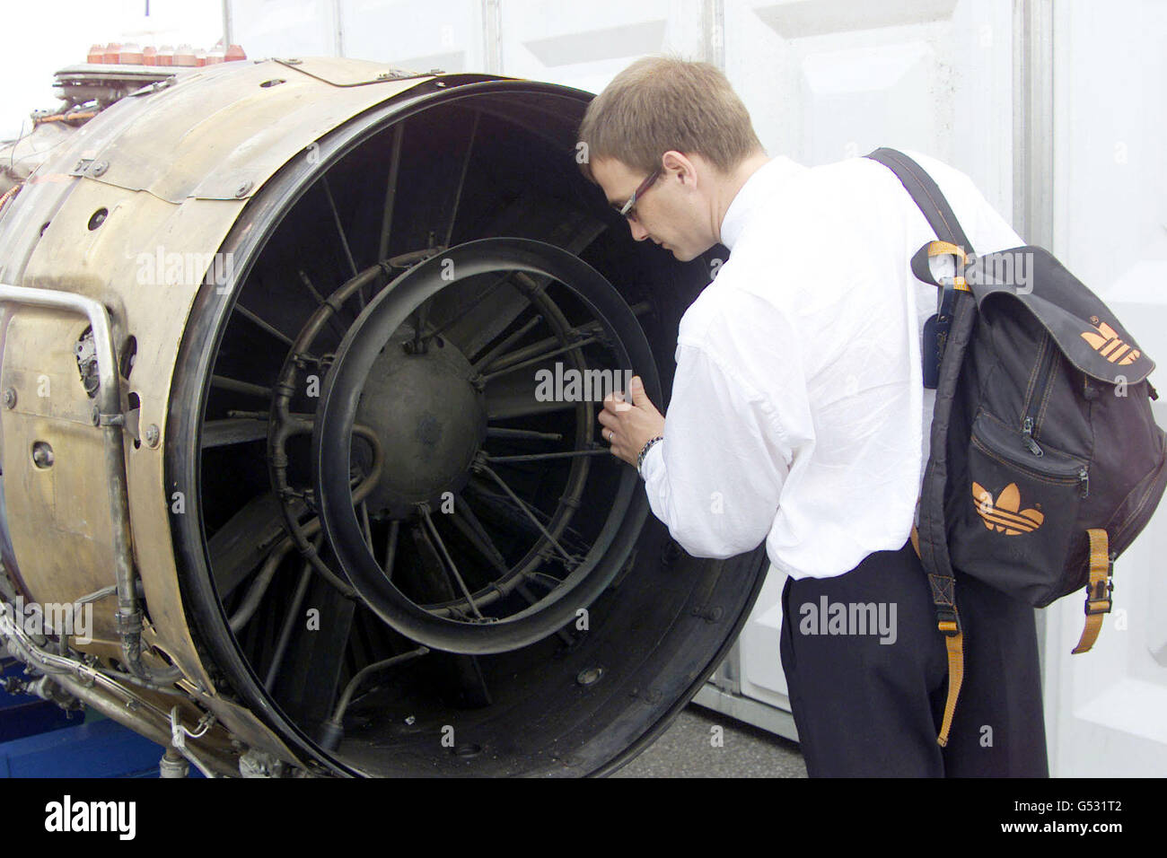 A visitor to the Farnborough Airshow looks at the afterburner section ...