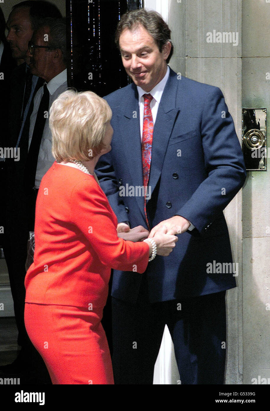 Tony Blair, British Prime Minister, shakes hands with Celia Larkin, a ...