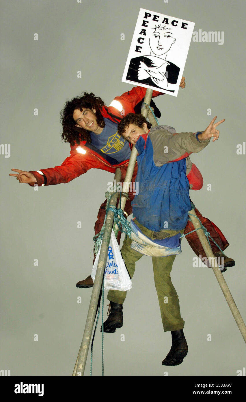 Two anti-nuclear protestors sit at the top of a 20ft high scaffolding ...