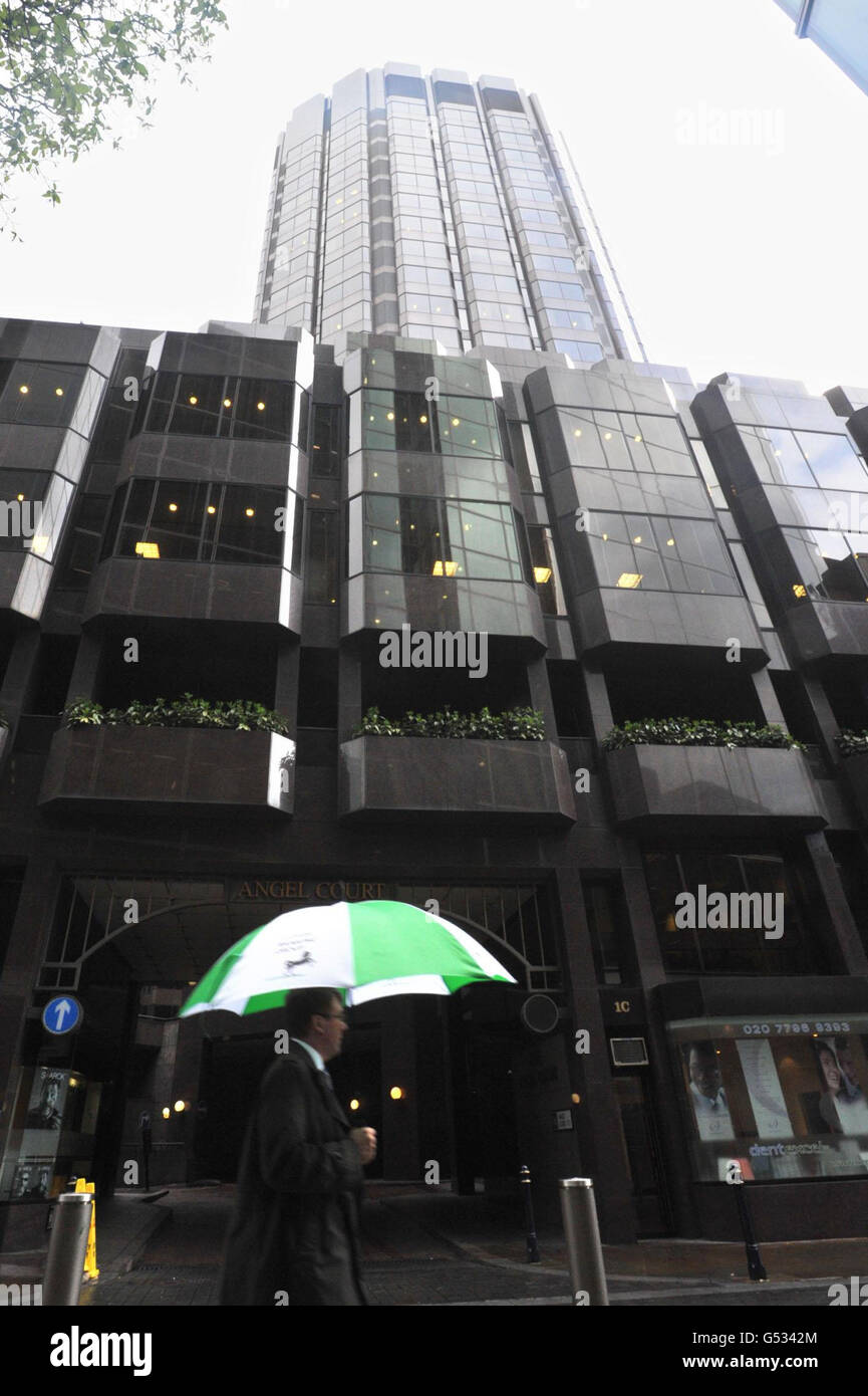 Man with lloyds bank umbrella walks past one angel court hi-res stock ...