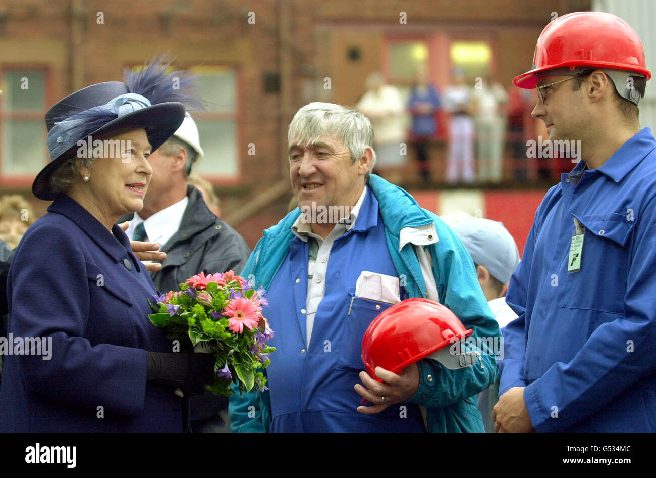 Queen Elizabeth II greets workers at a ceremony at Ferguson ...