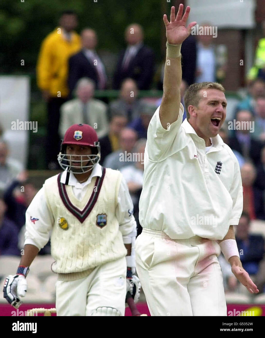 England bowler Dominic Cork celebrates after trapping Ramnaresh Sarwan ...