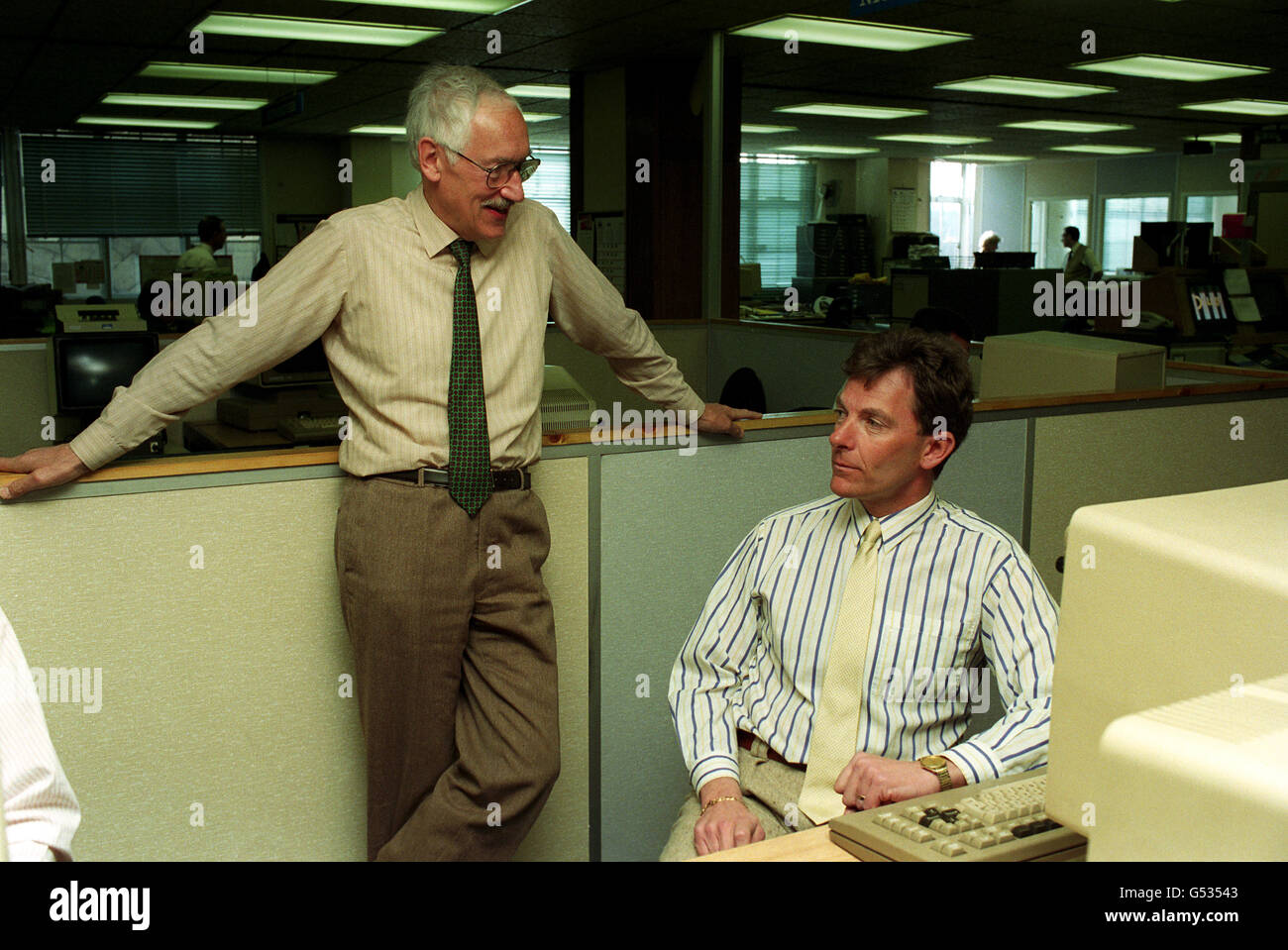 PA Associate Editor Reg Evans(standing) talks to PA's Dave Simpson ...