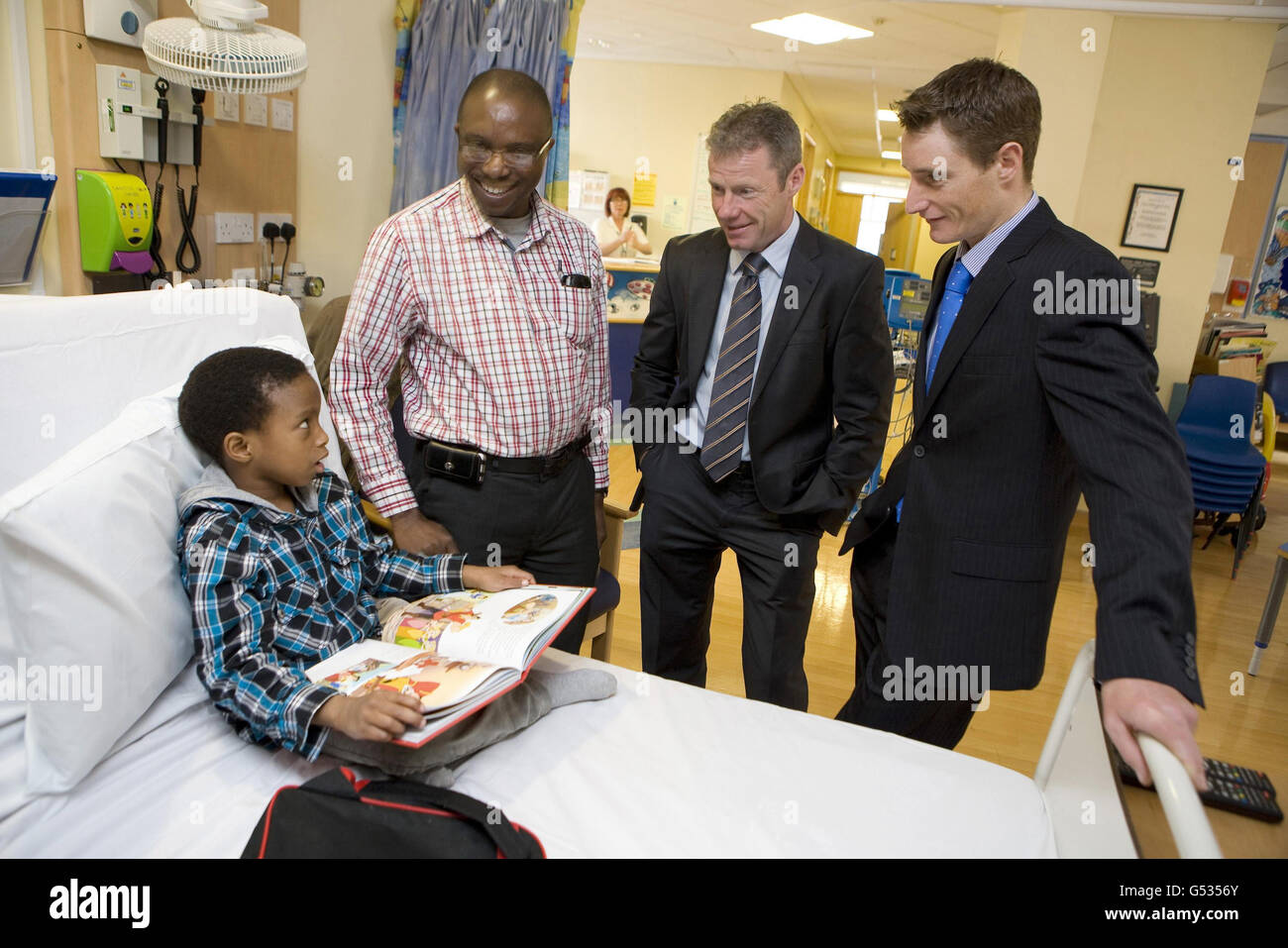 Mick Fitzgerald (second right) and Daryl Jacob meet six year old Joshua ...