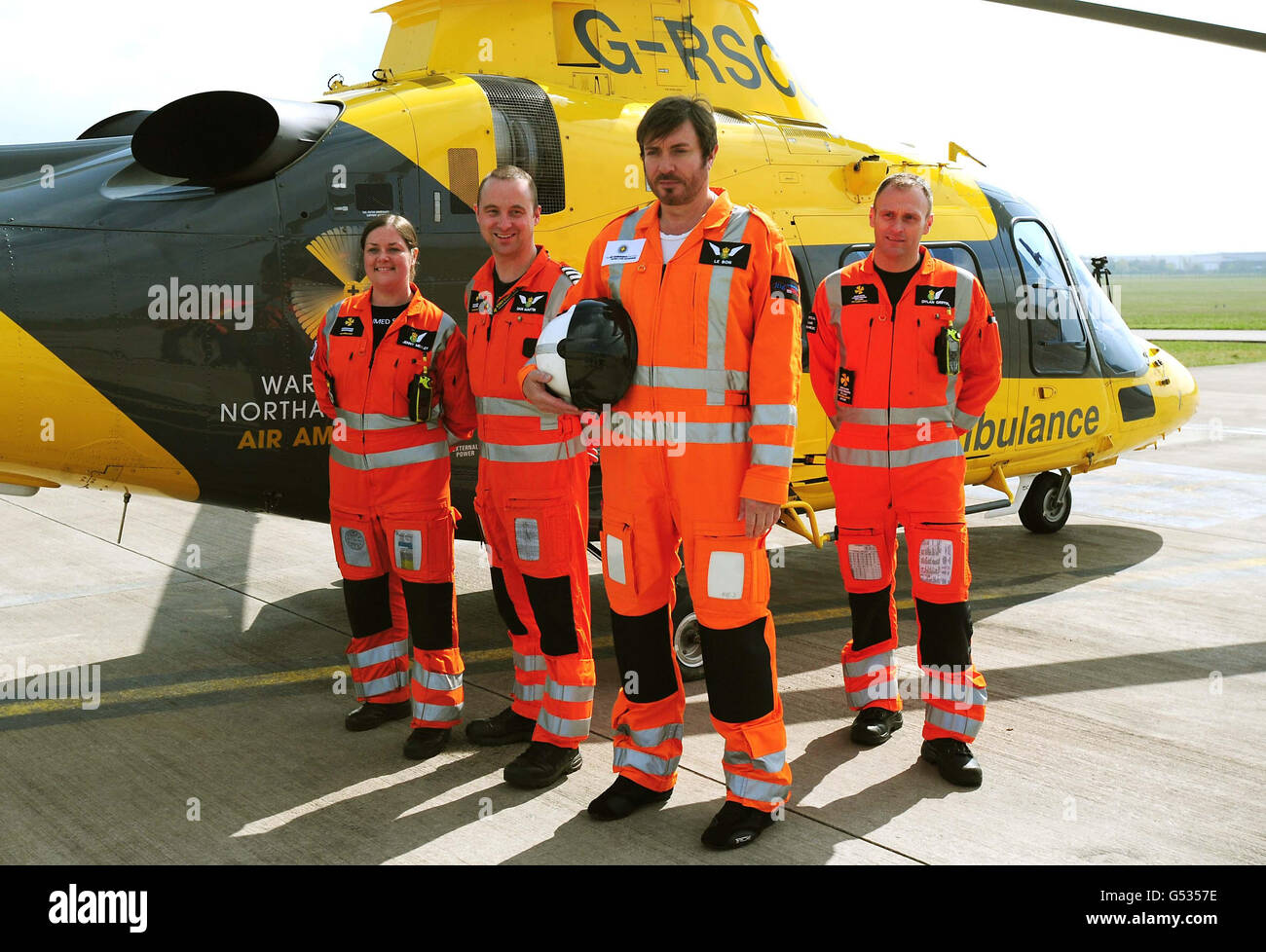 Simon Le Bon (centre) with Air Ambulance crew memebers (left-right ...