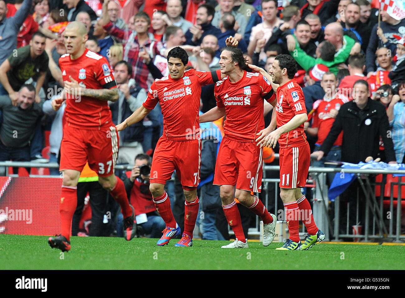 Liverpool's Andy Carroll (centre right) celebrates scoring the winning ...
