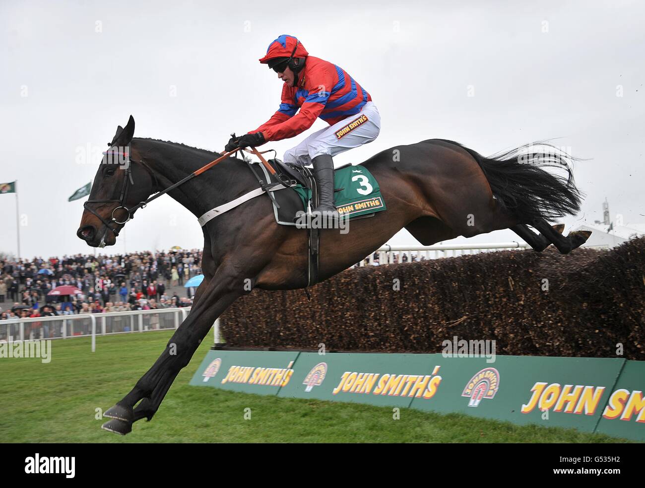 Sprinter Sacre ridden by Barry Geraghty jumps the fence to gon on and ...