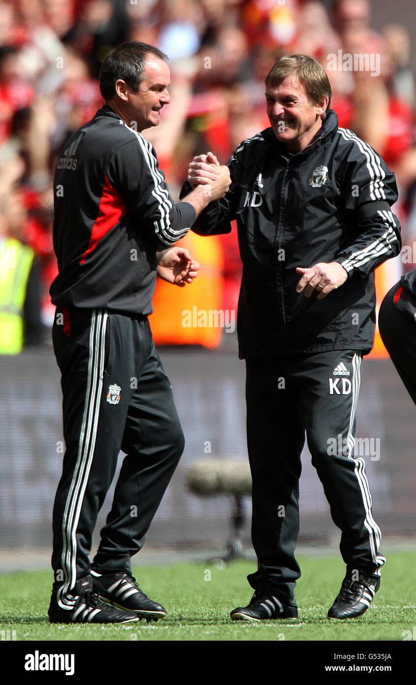 Liverpool manager Kenny Dalglish celebrates with first team coach Steve ...
