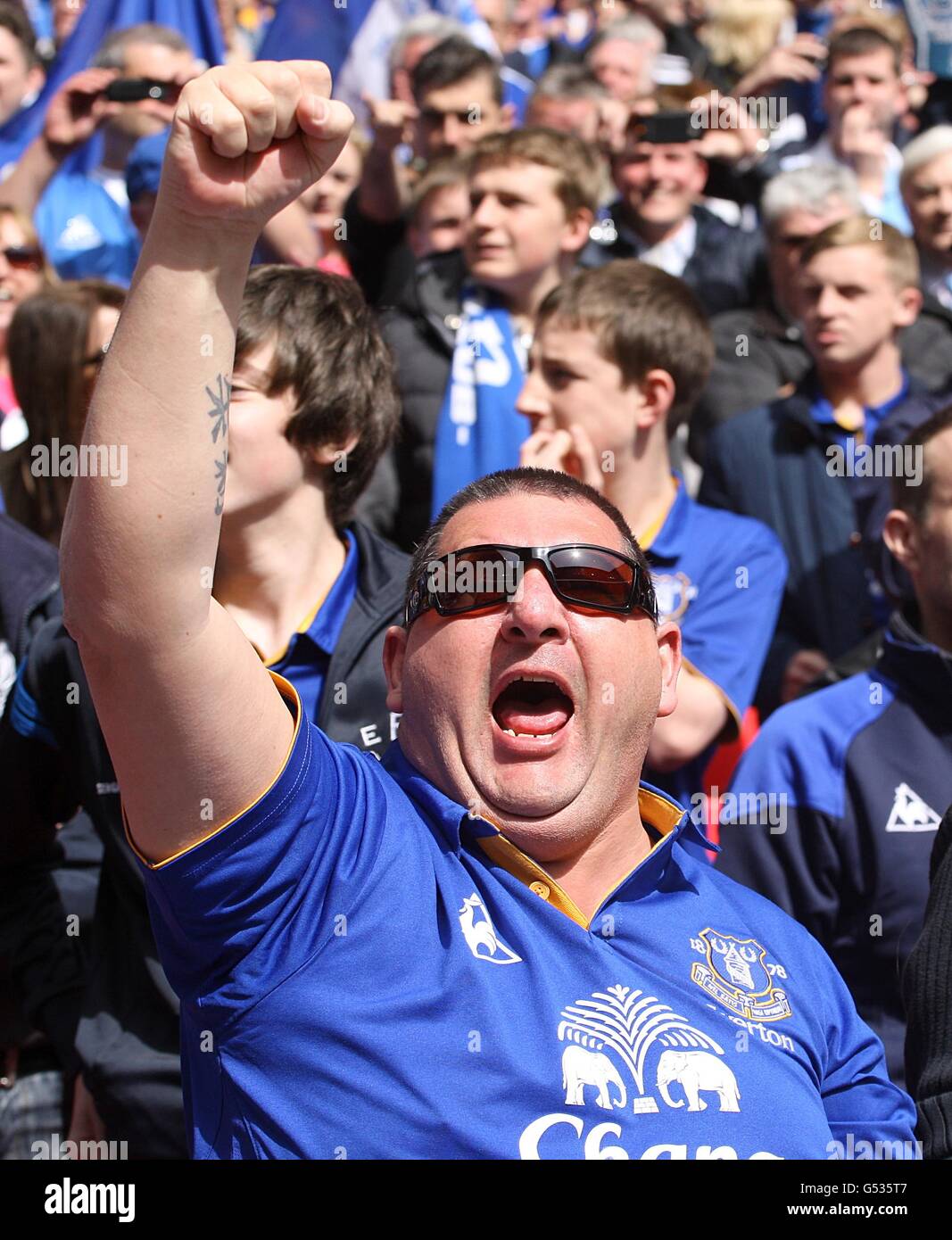 An Everton fan shows support for his team in the stands Stock Photo - Alamy