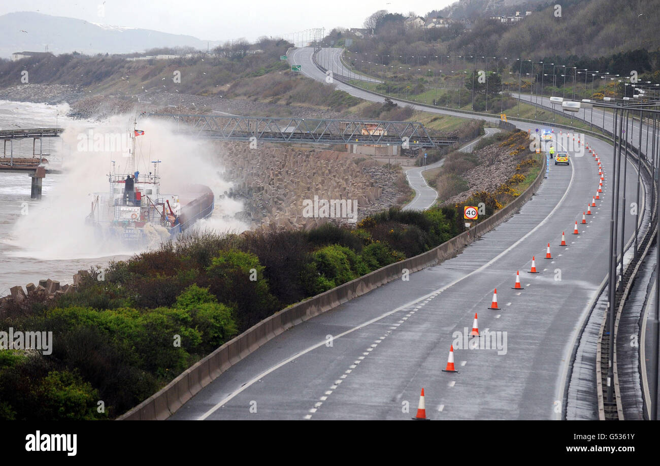 Cargo ship run aground. A cargo ship is seen by the beach at Llanddulas ...