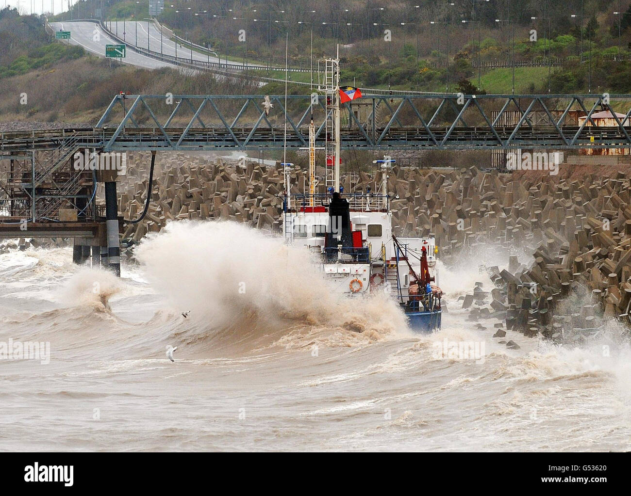 Cargo ship run aground. A cargo ship is seen by the beach at Llanddulas ...
