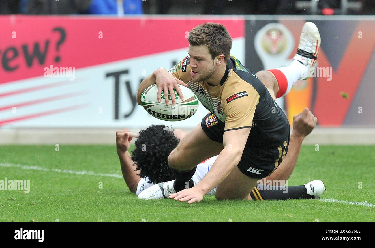 Wigan's George Darrell Goulding goes over for a try past St Helens Sia ...