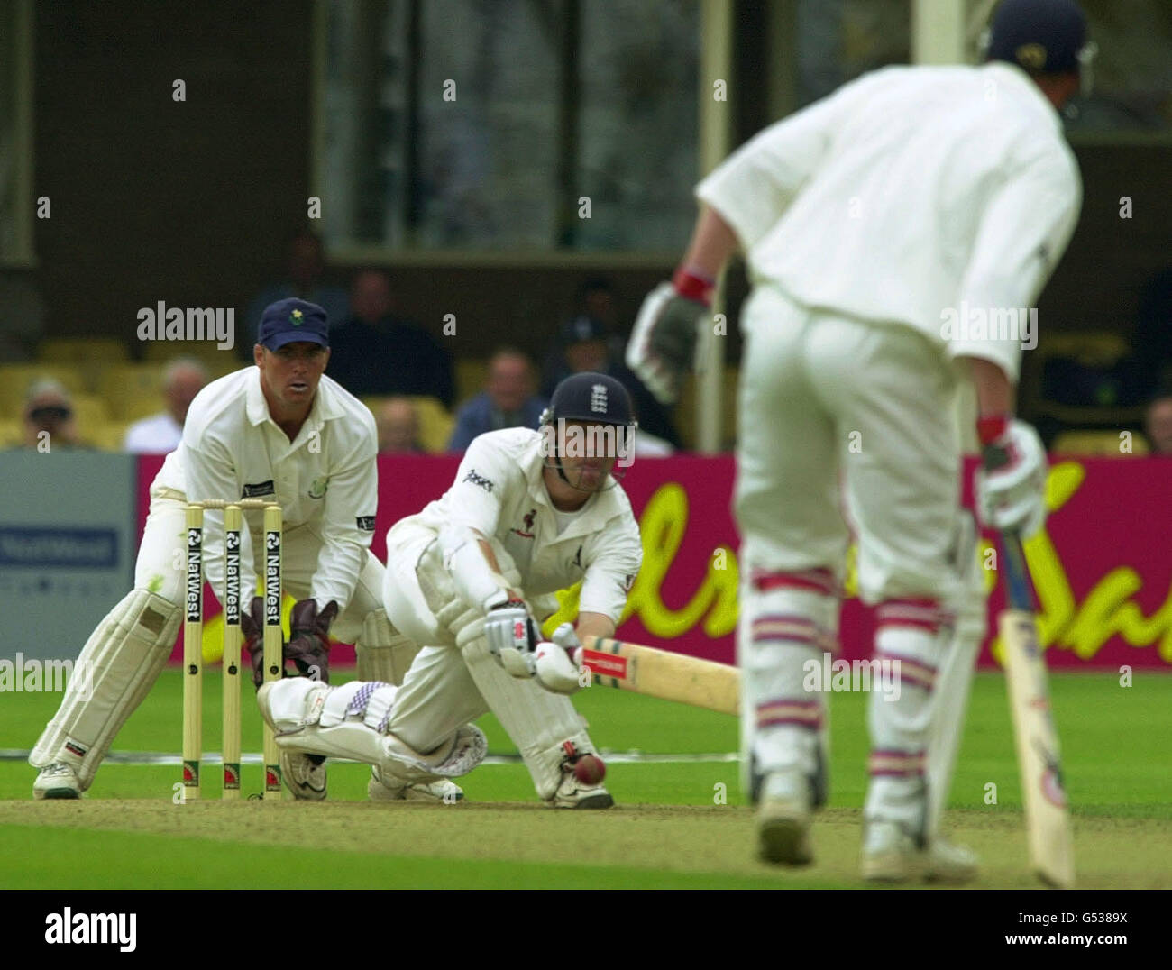 Warwickshire's Nick Knight (C) sweeps off Robert Croft's bowling during ...