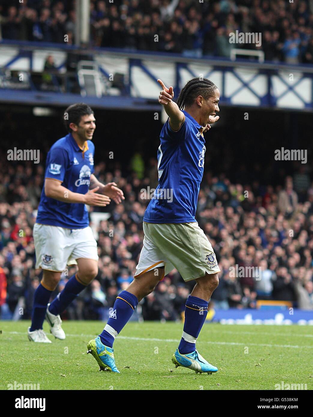 Everton's Steven Pienaar celebrates teammate Leon Osmans goal Stock ...