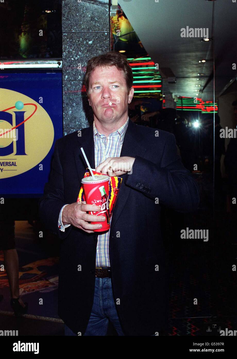 TV presenter and comedian Jim Davidson enjoys some popcorn at the UK ...