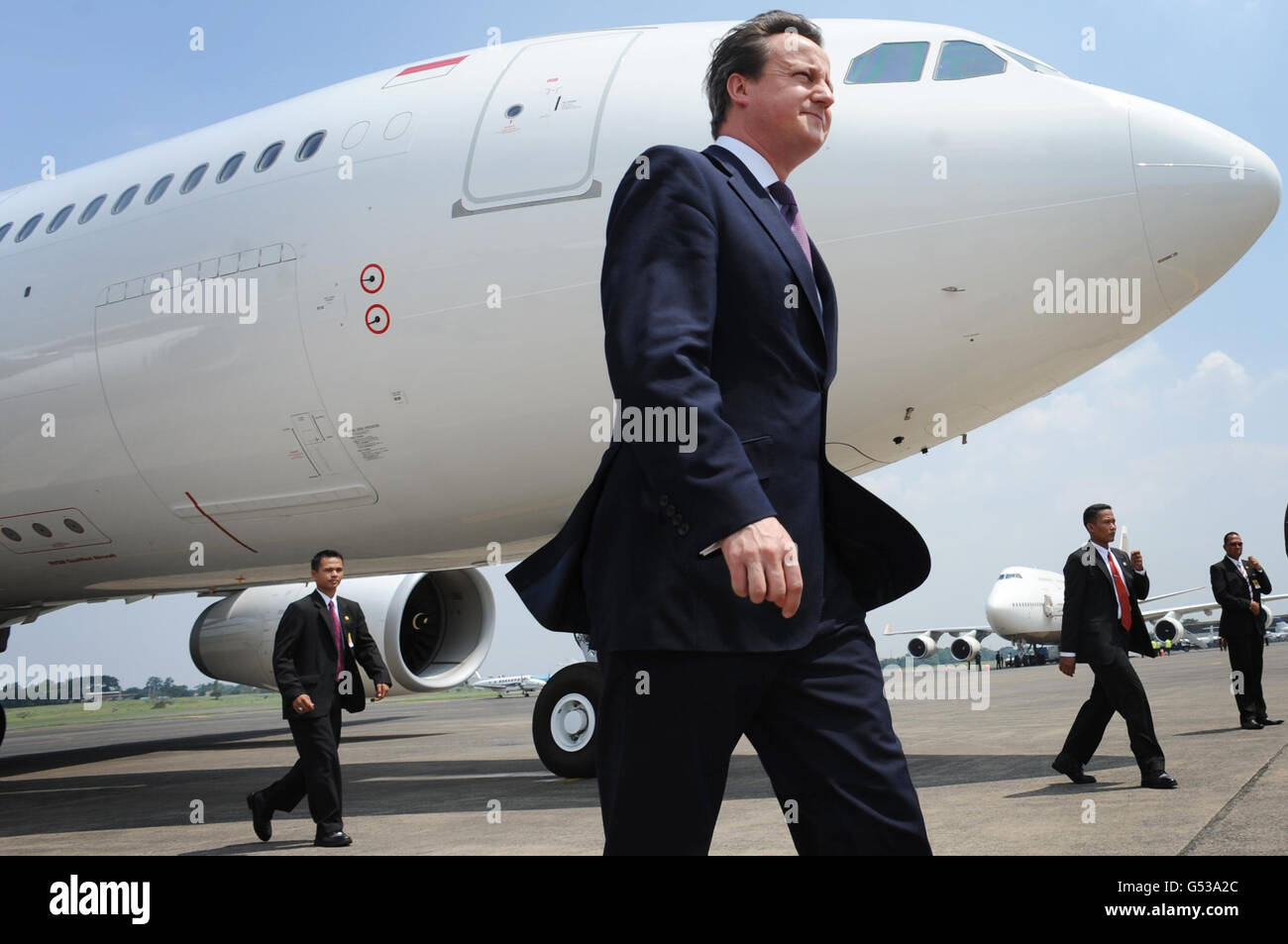 Prime Minister David Cameron in front of a Garuda Indonesia Airlines ...