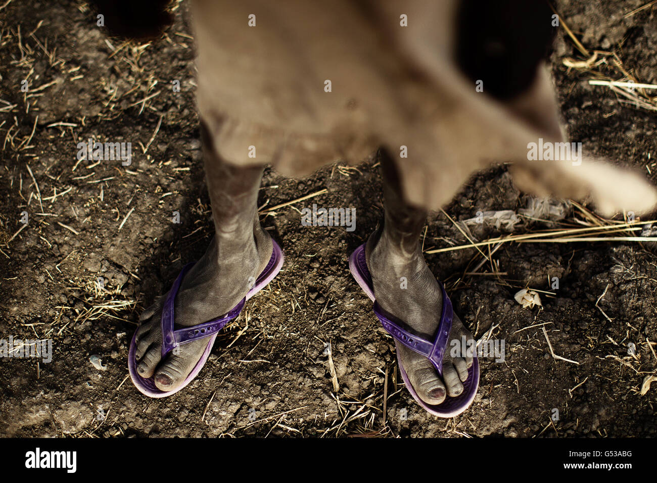 A child stands on the parched earth in Balliet,a village along the ...