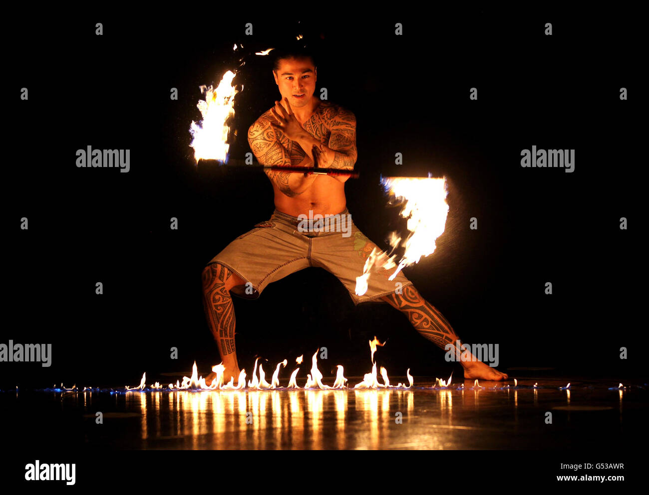 Mica Naruo performs " Fire knife Dance" during rehearsals at the SECC ...
