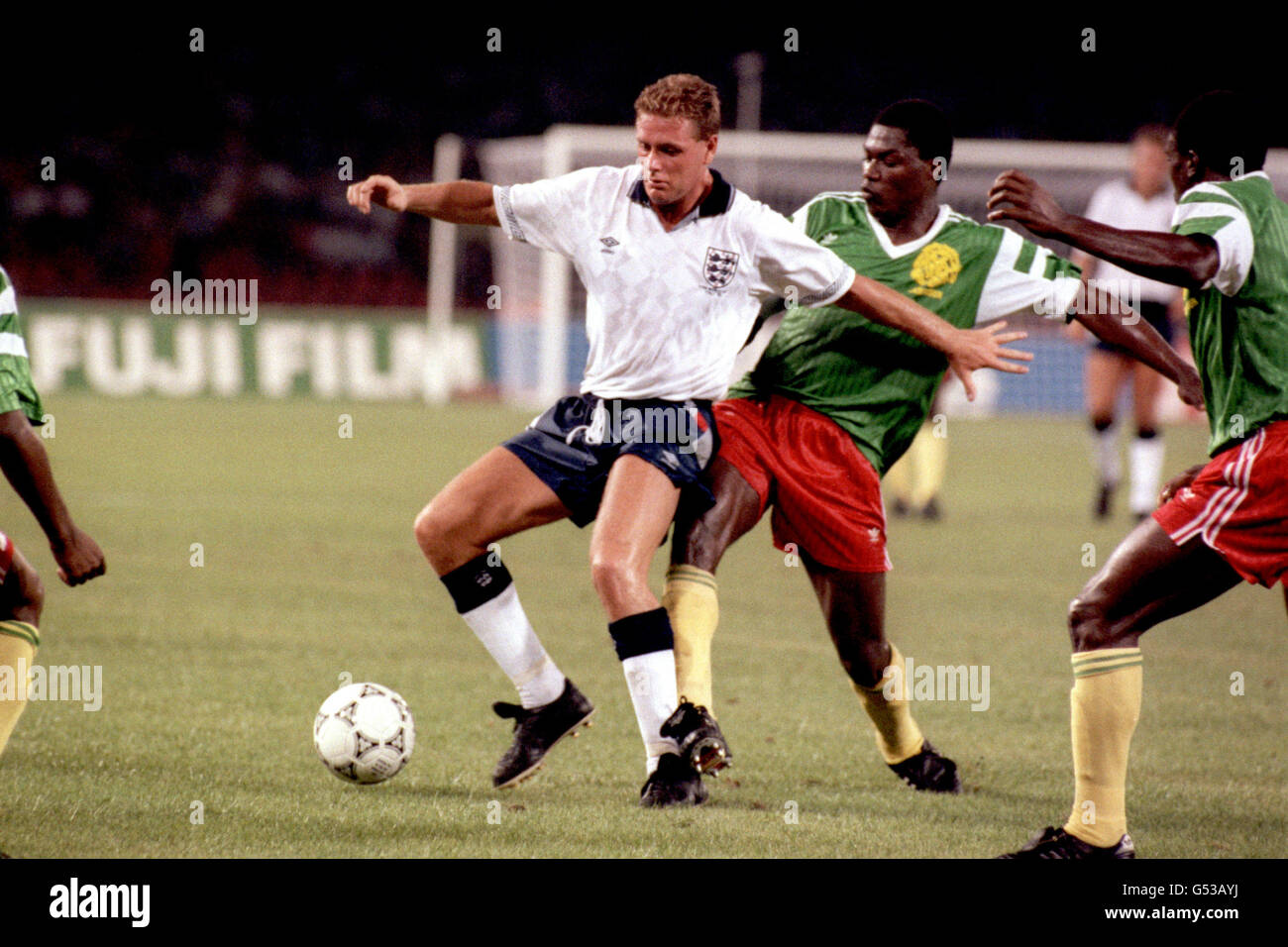 Englands paul gascoigne holds off cameroons emmanuel makanaky hi-res ...
