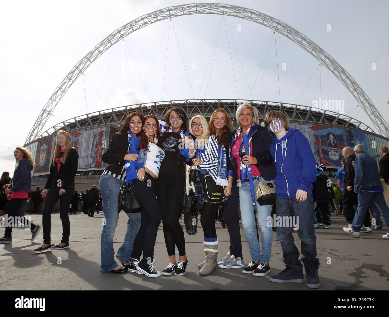 A group of Everton fans who work for the Everton fan centre show their ...